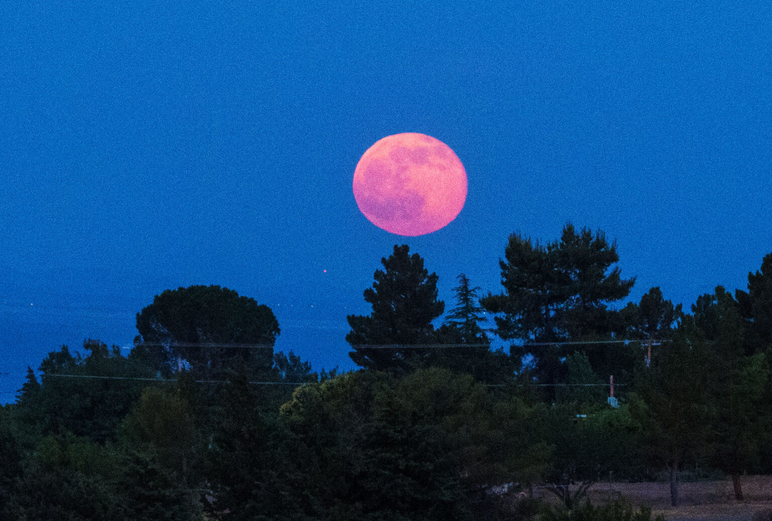 A stunning "Strawberry Moon" will rise Thursday. Here's what that means ...