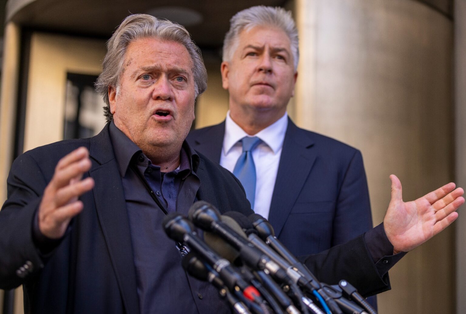 Watch: Steve Bannon, forced to surrender to authorities, suffers a ...